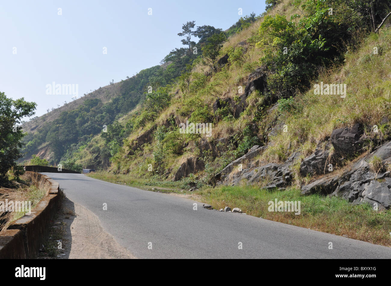 A dangerous and narrow road cut out from the mountain side Stock Photo ...