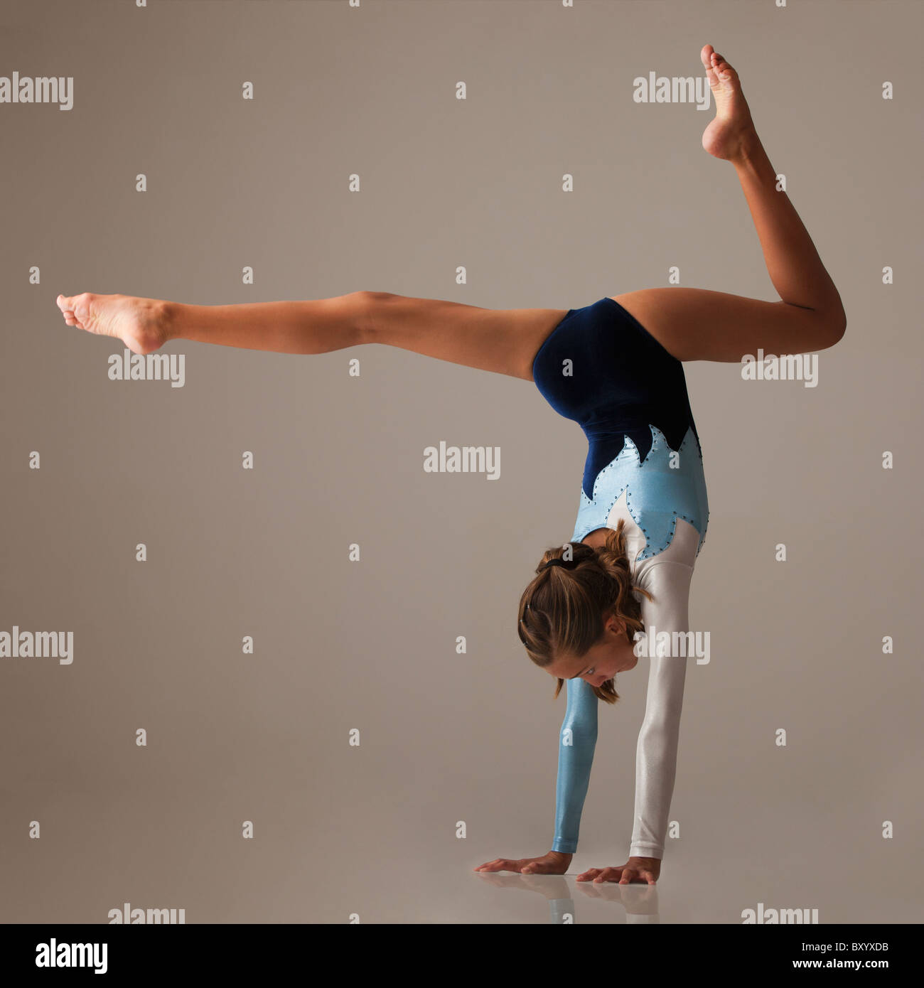 Female gymnast performing handstand Stock Photo - Alamy