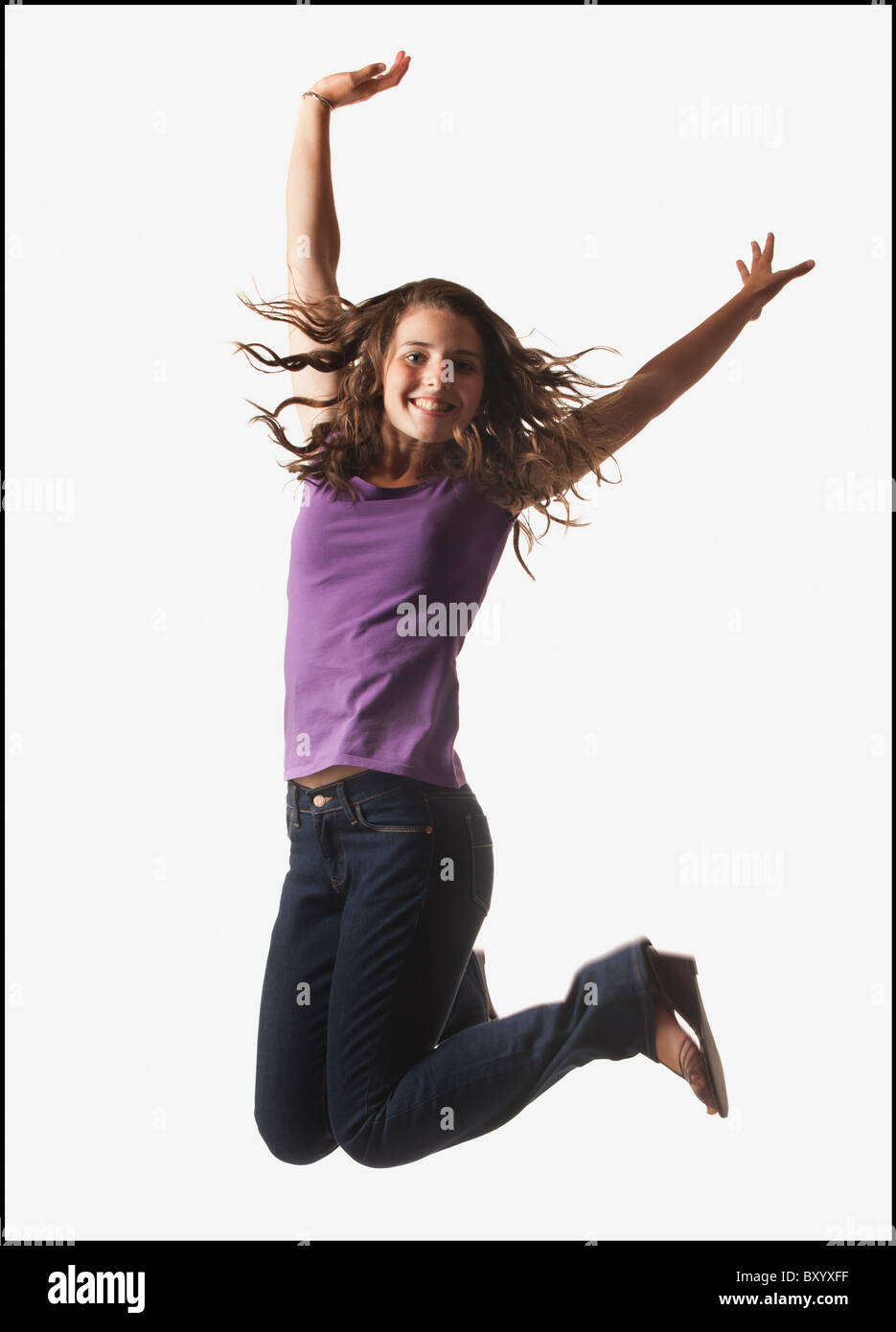 Woman jumping on white background Stock Photo - Alamy