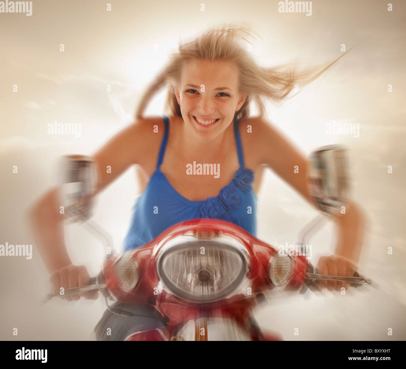 Young girl riding scooter Stock Photo - Alamy