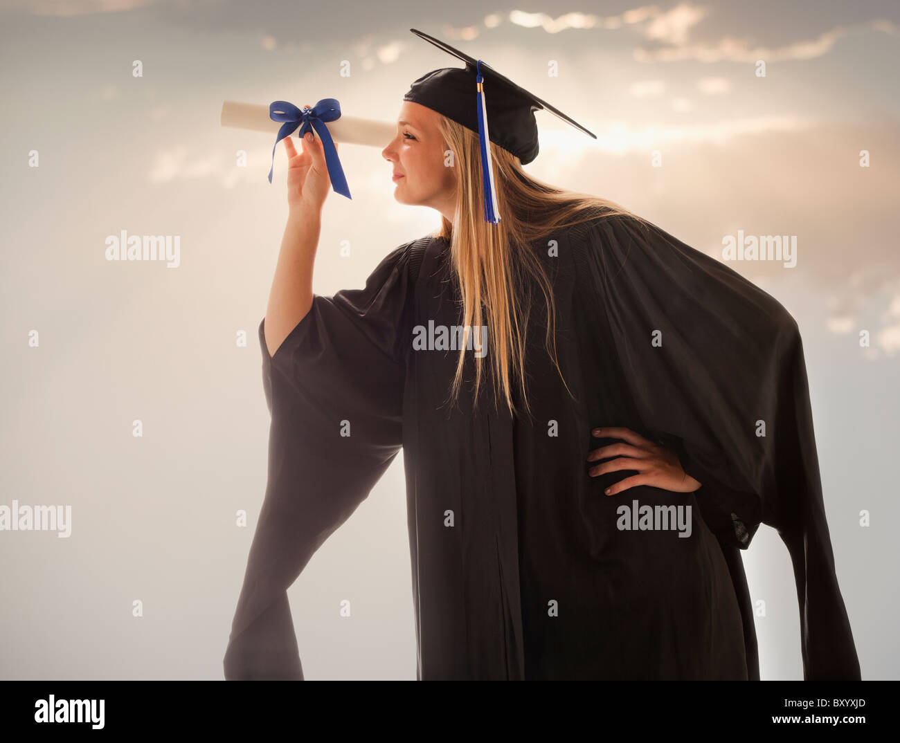 Young girl wearing graduating gown Stock Photo - Alamy