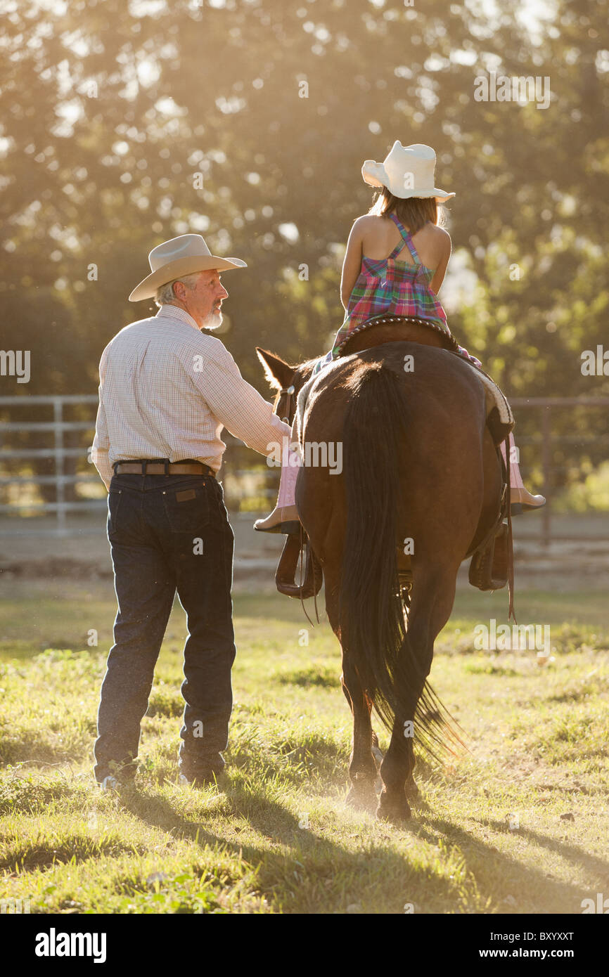 Grandfather grandchild riding horse hi-res stock photography and images ...