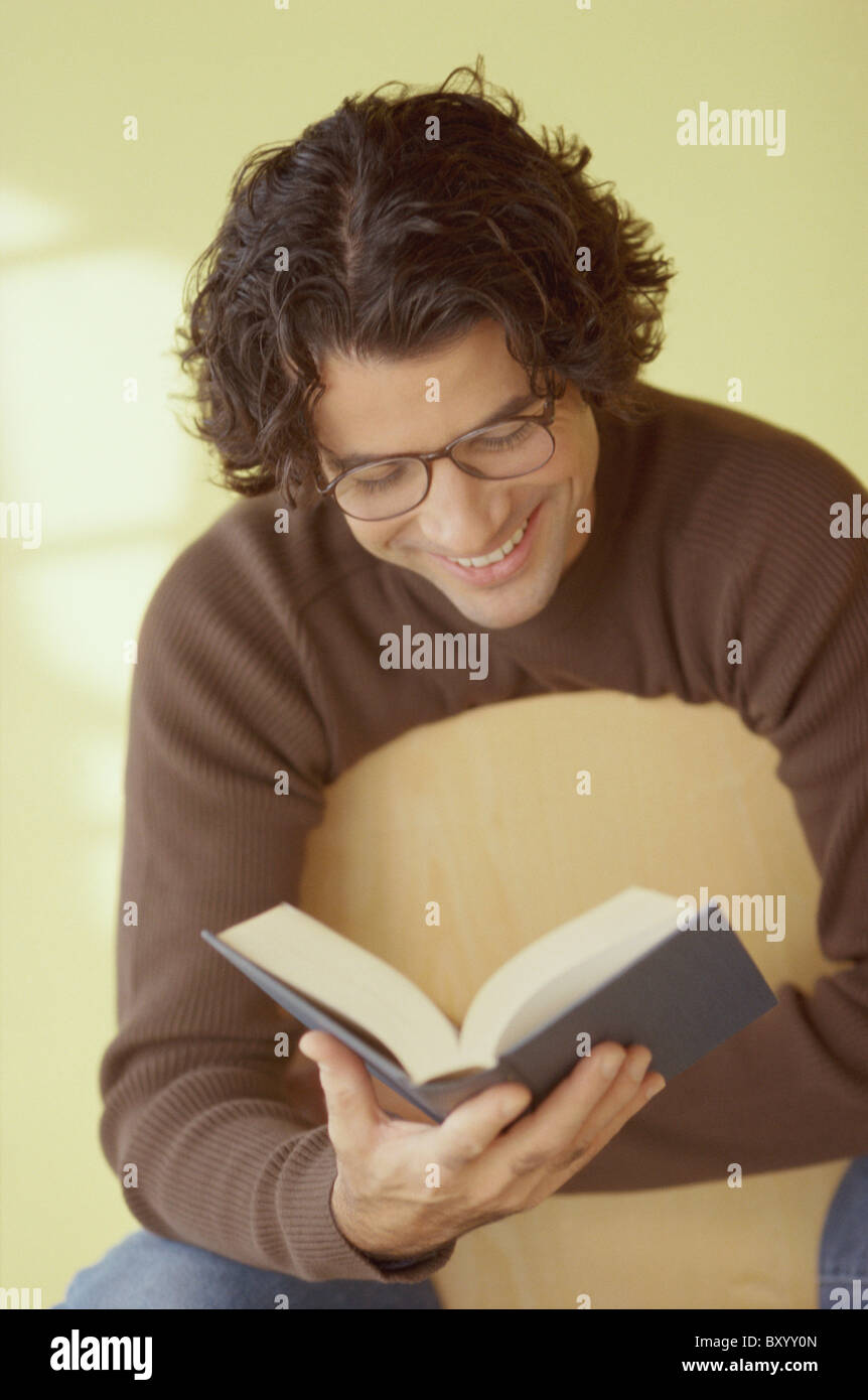 Man reading a book Stock Photo - Alamy