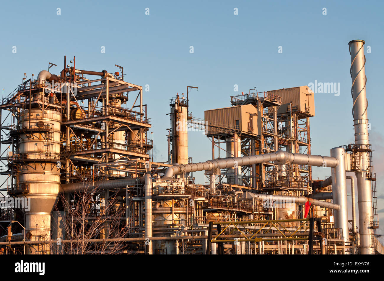A petrochemical refinery plant with pipes and cooling towers Stock ...