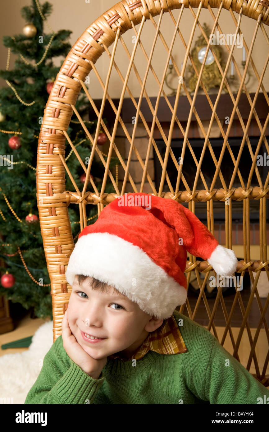 Portrait of boy wearing santa cap looking at camera with smile Stock ...