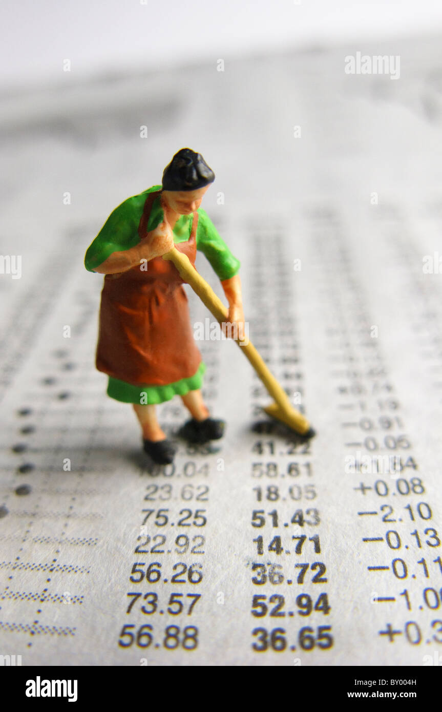 Model woman sweeping financial figures Stock Photo - Alamy