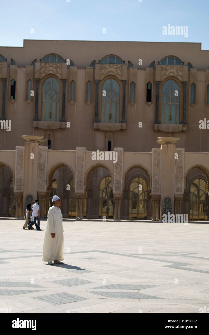 A Moroccan man in his traditional robe makes a visit to the holy place ...