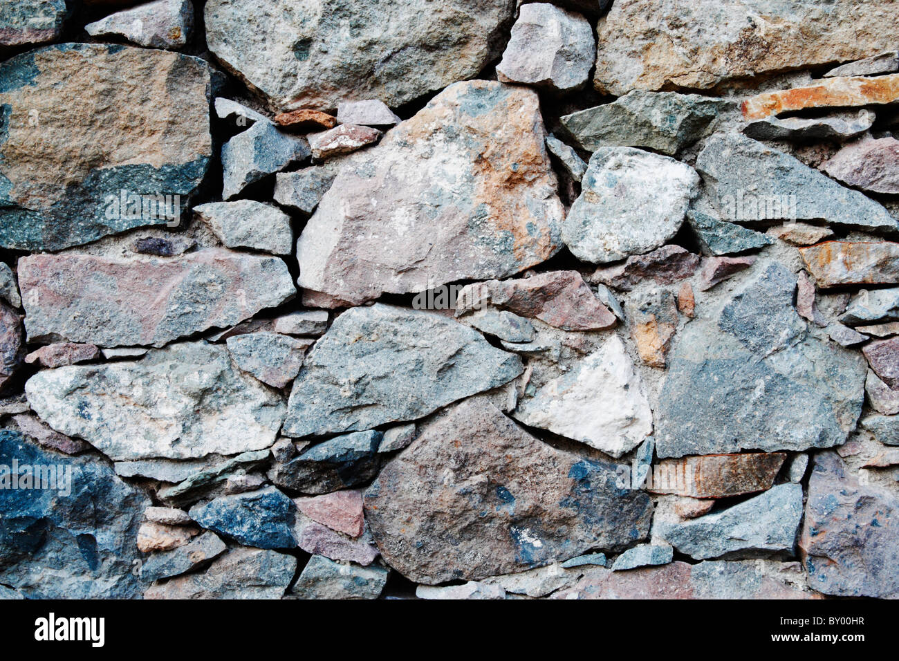 Stone wall of house in Spain Stock Photo - Alamy