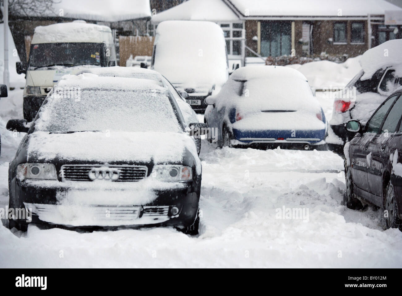 Cars covered with snow in a car park Stock Photo - Alamy