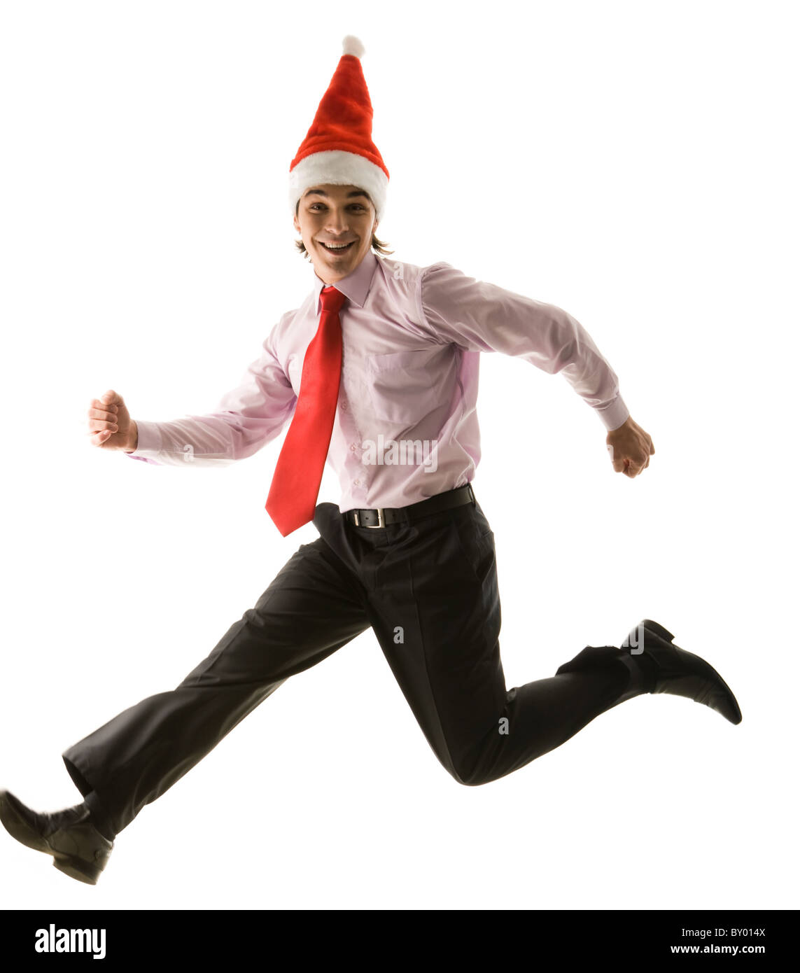 Full-size view of running santa looking at camera and smiling over ...
