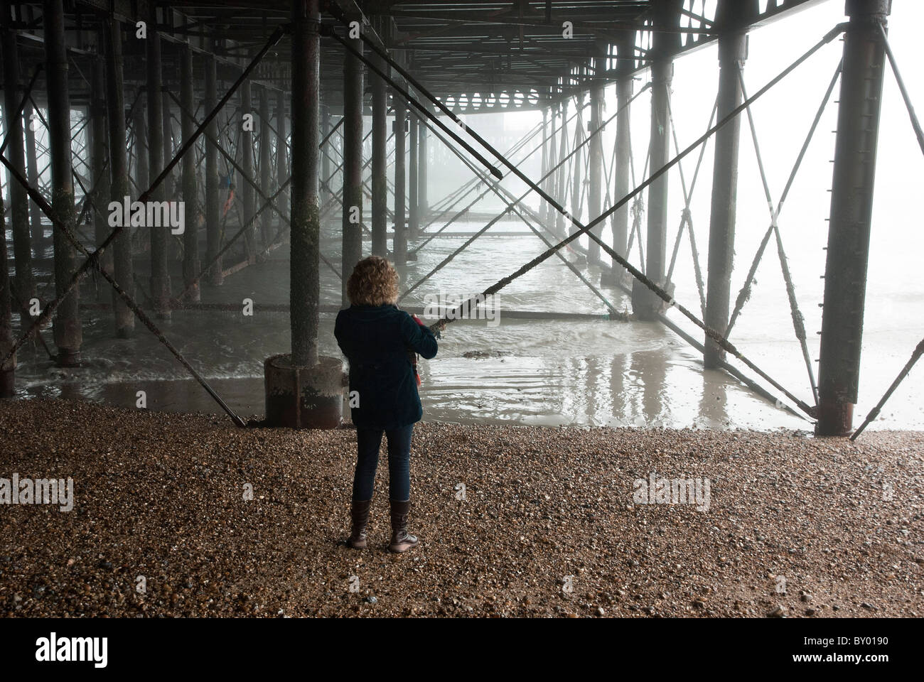 Woman taking a photograph at the seaside hi-res stock photography and ...