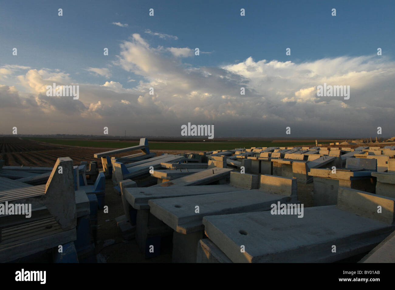 Stack of precast concrete wall panels at the northern border with the ...