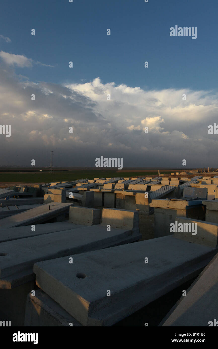Stack of precast concrete wall panels at the northern border with the ...