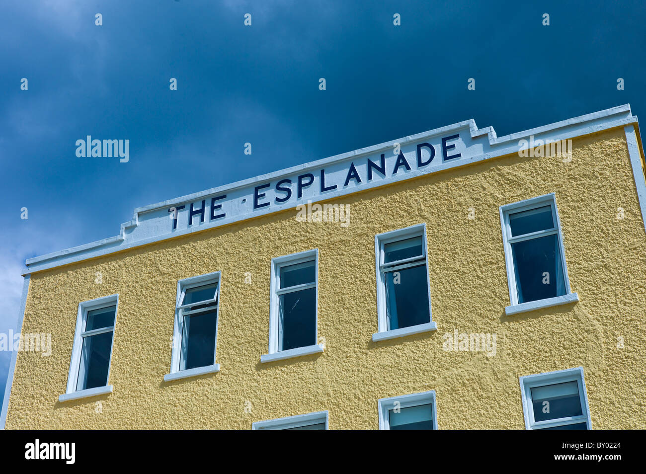 Brightly coloured Esplanade Hotel on the seafront at Kilkee popular ...