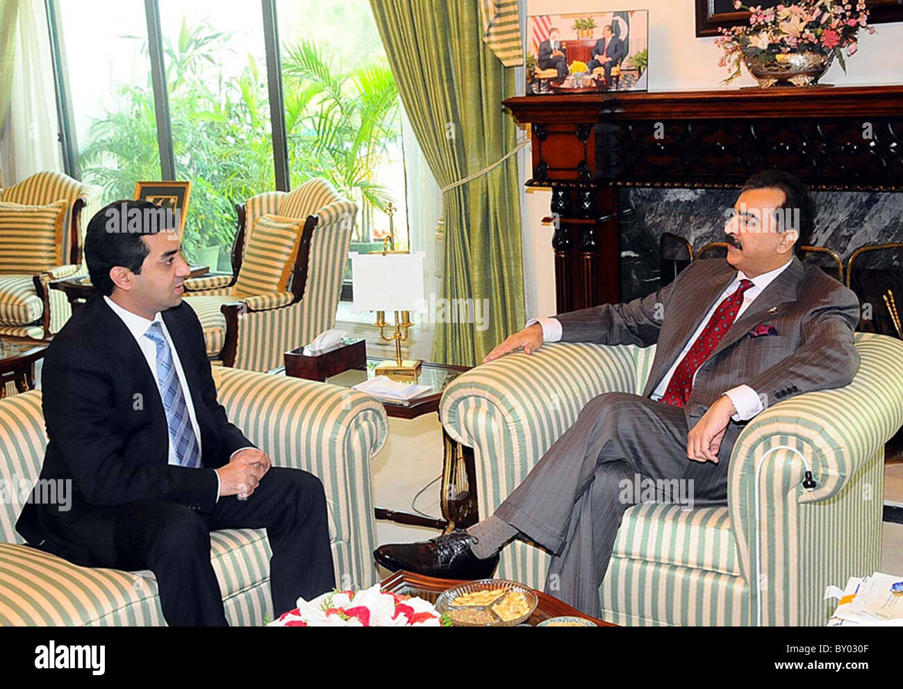 Prime Minister, Syed Yousuf Raza Gilani talks with MNA Muhammad Asim ...