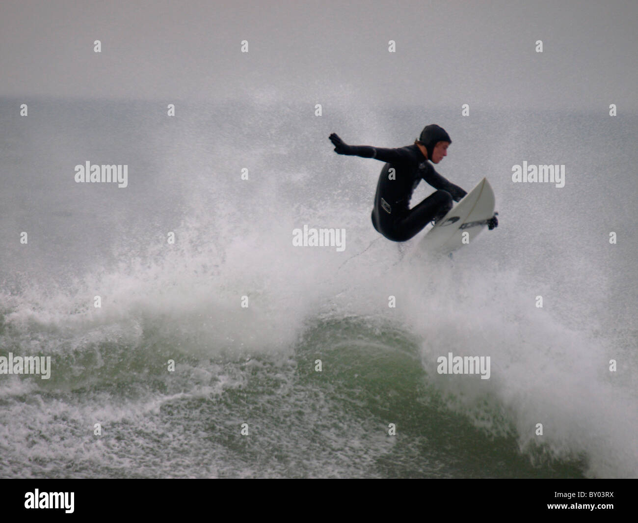 Surfer Cornwall in winter, Cornwall, UK Stock Photo - Alamy