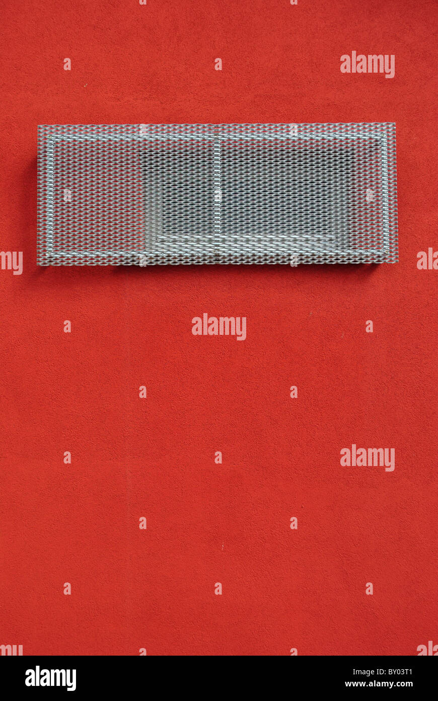 window with metal grille and red wall Stock Photo - Alamy