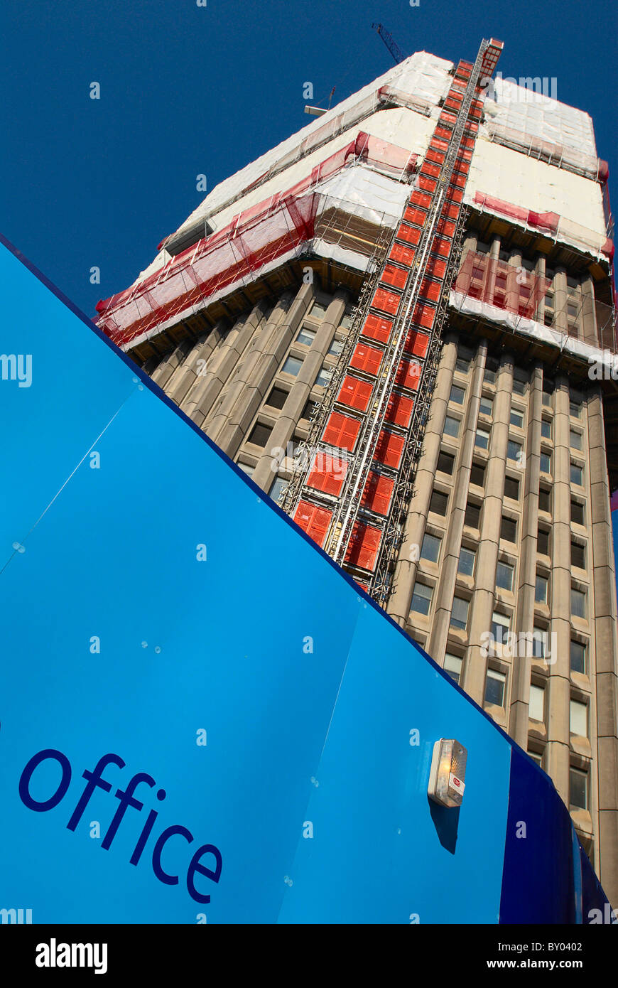 Access elevator on side of 1970s office tower under refurbishment ...