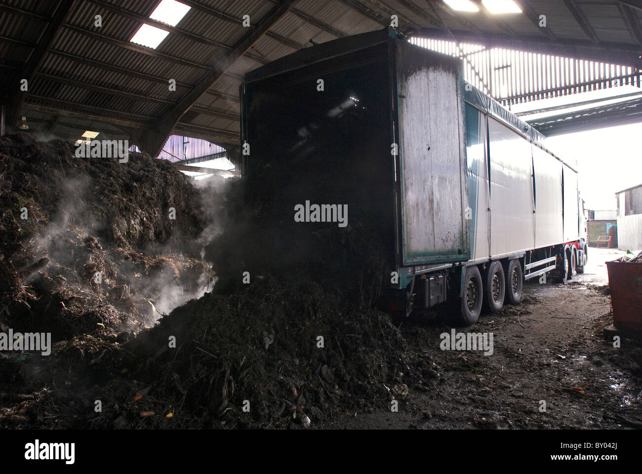 Recycling lorry unloading green waste hi-res stock photography and ...