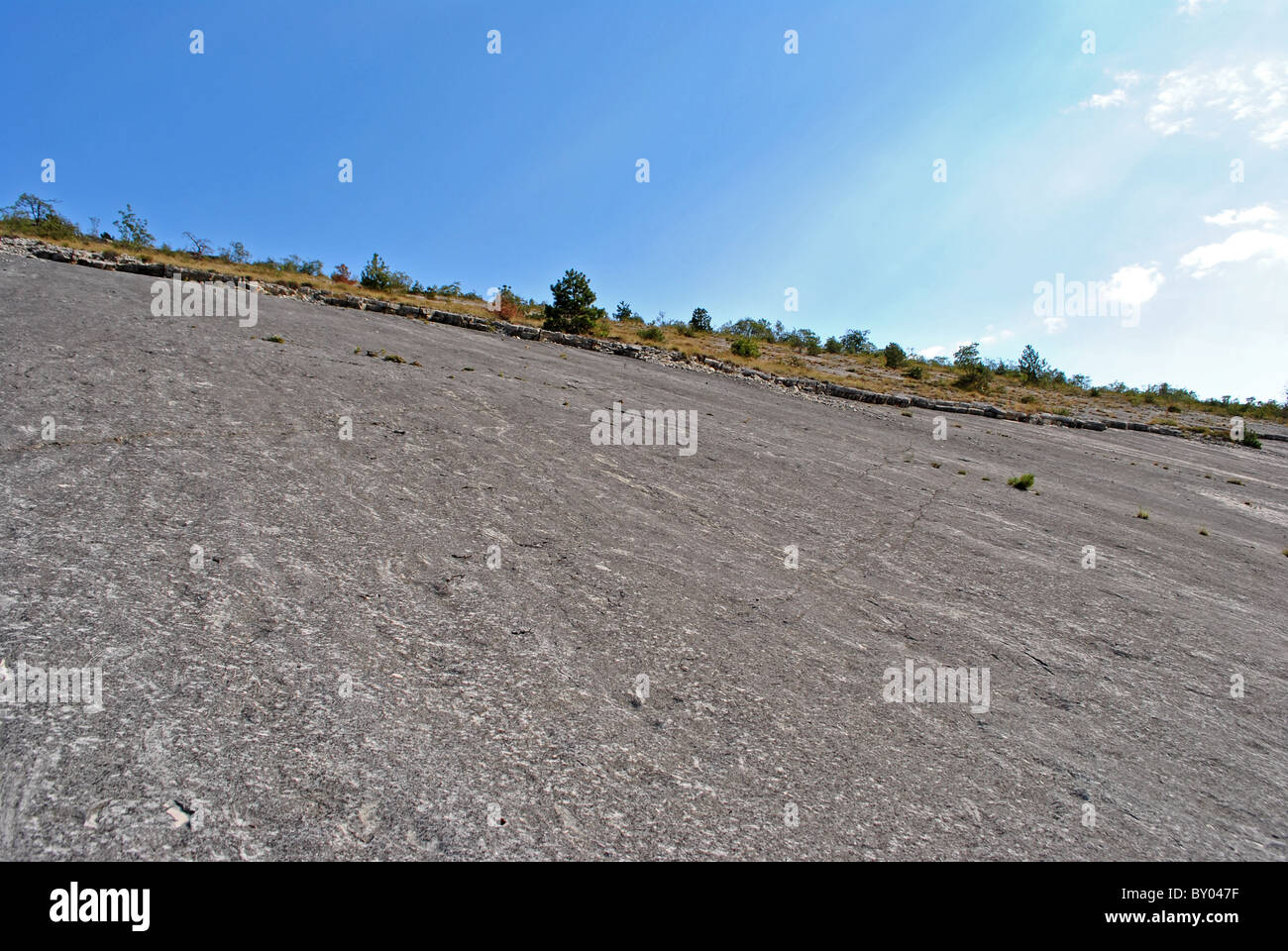 slope with smooth slab of rock Stock Photo - Alamy