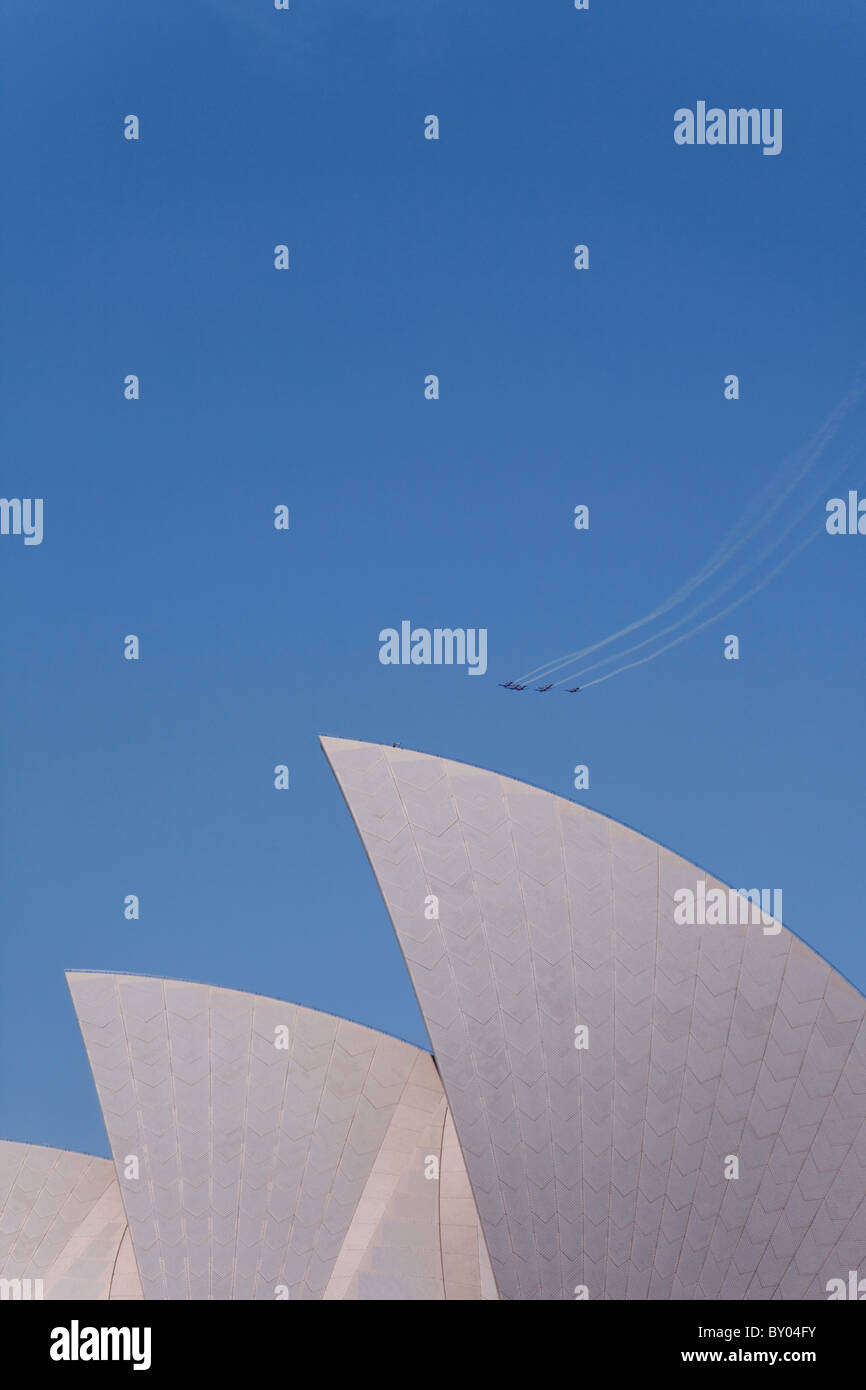 blue sky over sydney opera house roof with planes aerobatic display ...