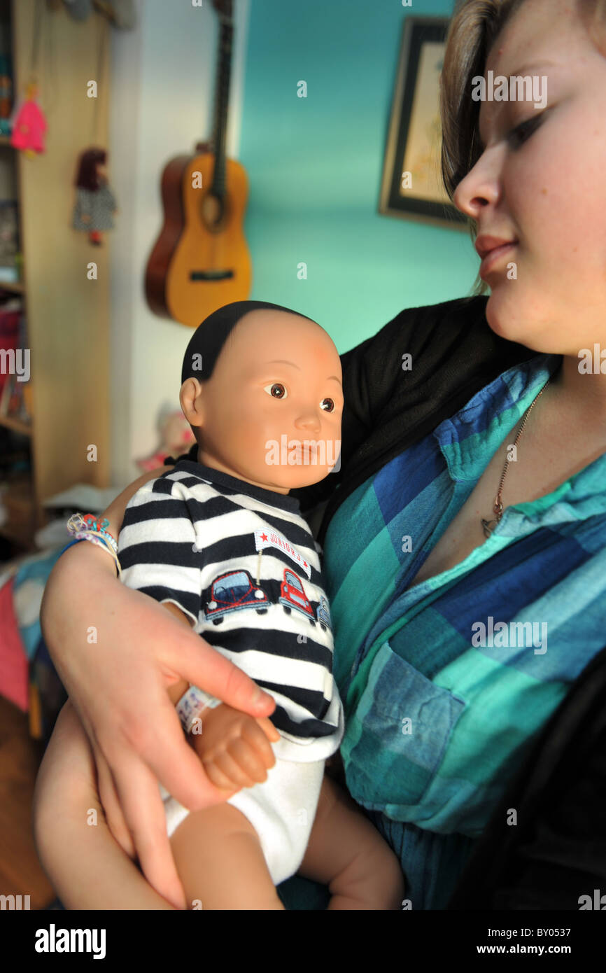 A 13 year old girl minds a 'real care baby' for the weekend as part of ...
