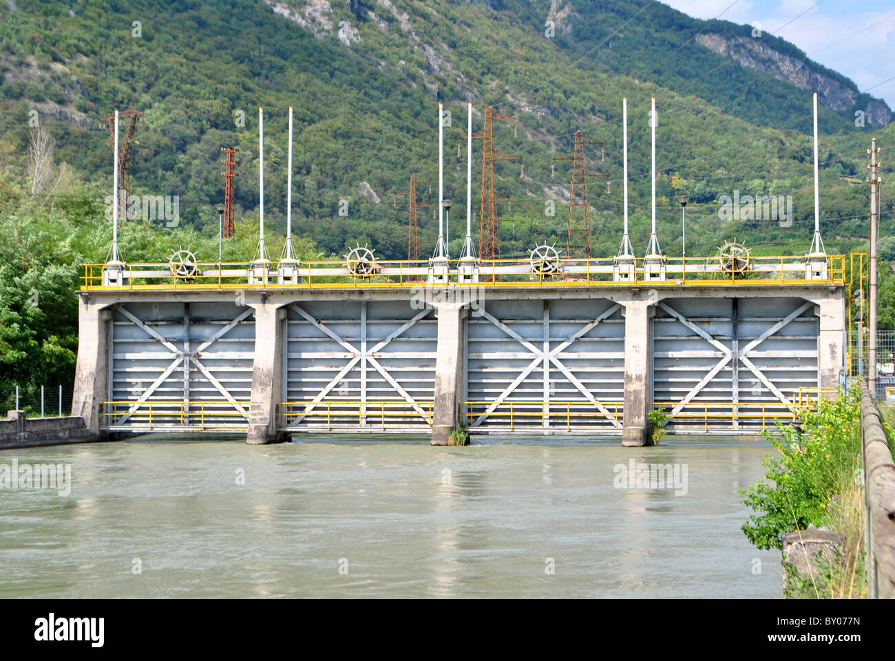 artificial dam on the river, surrounded by nature Stock Photo - Alamy