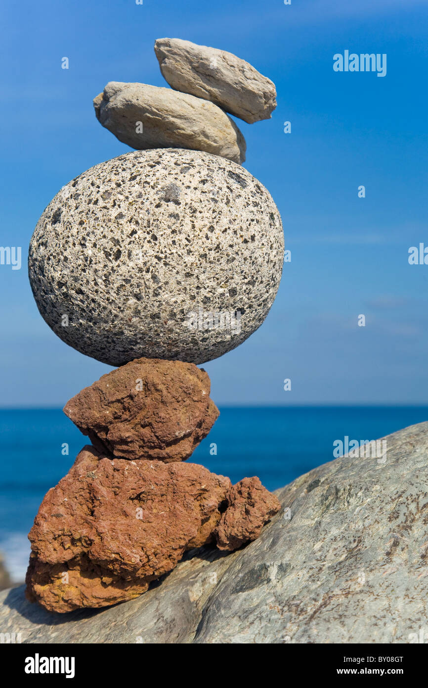 Stack of volcanic pebbles by the sea Stock Photo - Alamy