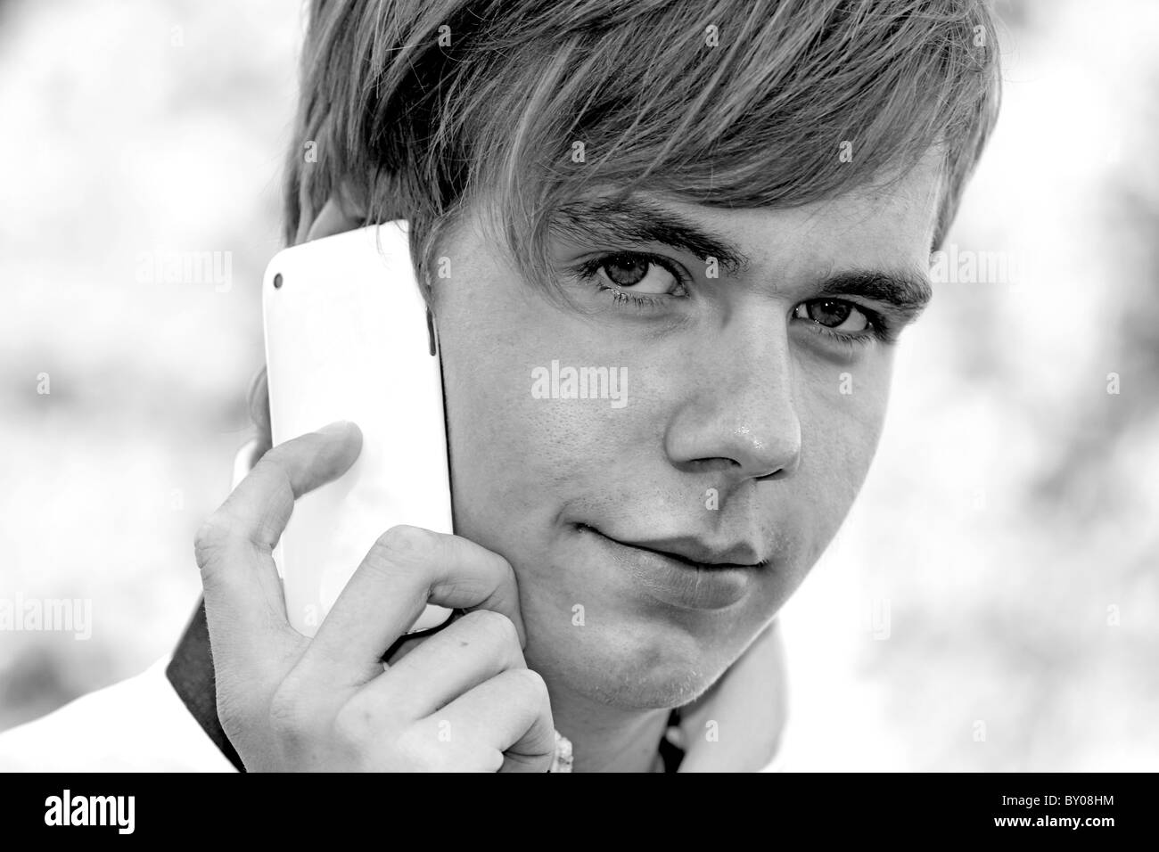 Young man talking mobile phone Black and White Stock Photos & Images ...