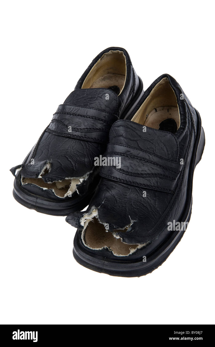 object on white - Damaged old shoes Stock Photo - Alamy