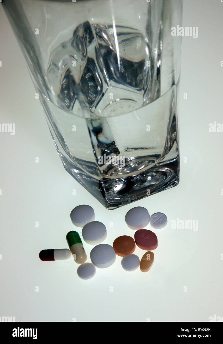 Prescription medications, London, UK with glass of water Stock Photo ...