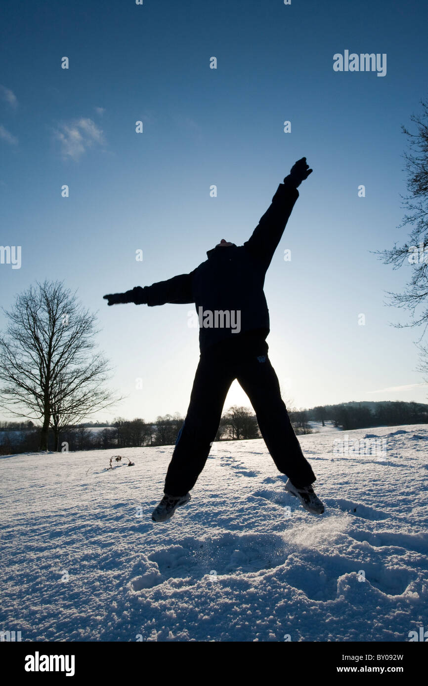 boy doing star jump Stock Photo - Alamy