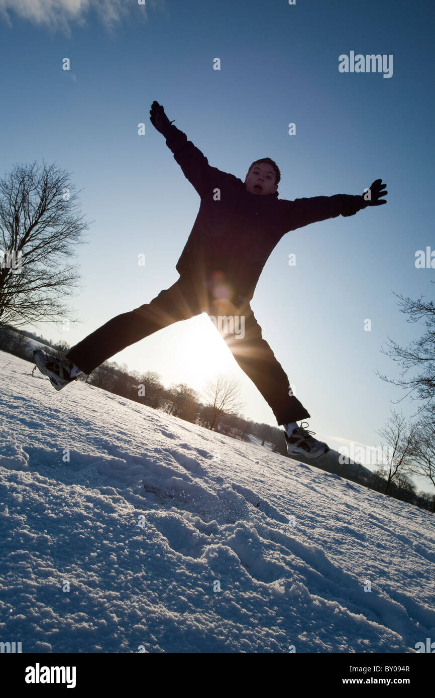 boy doing star jump Stock Photo - Alamy