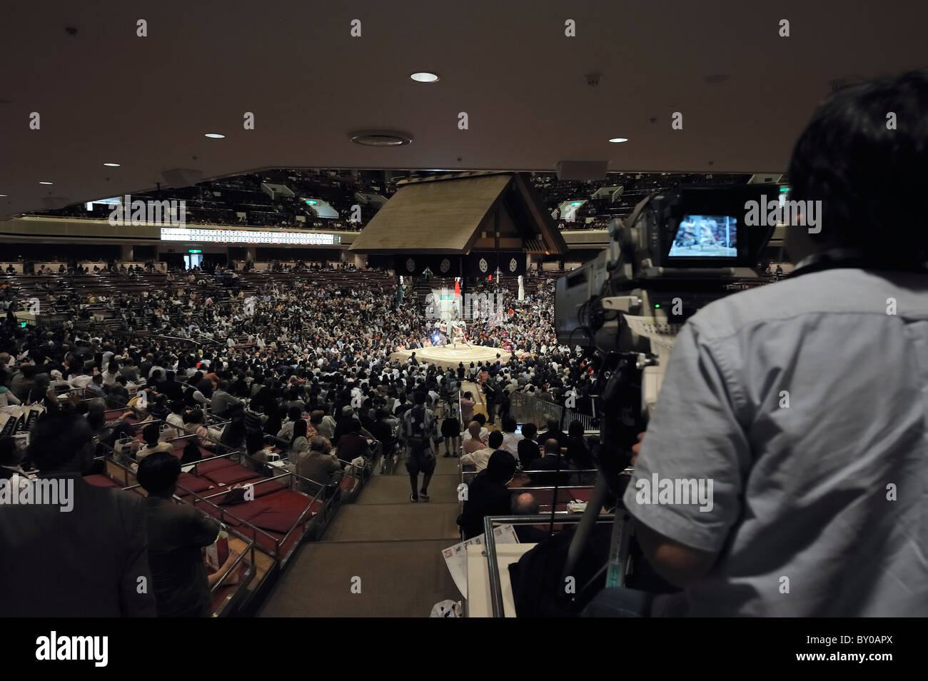 Cameraman making a close-up of the ring, Grand Sumo Tournament May 2010 ...