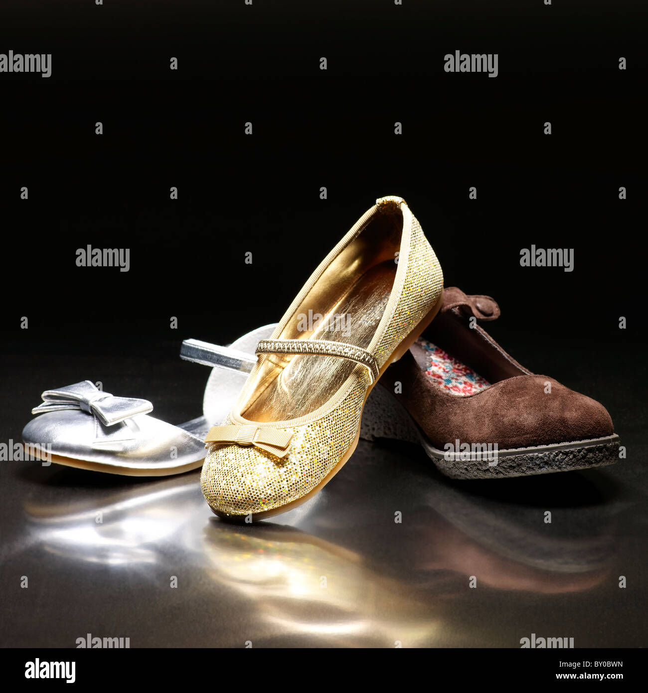 three 3 girls fashion shoes Stock Photo - Alamy
