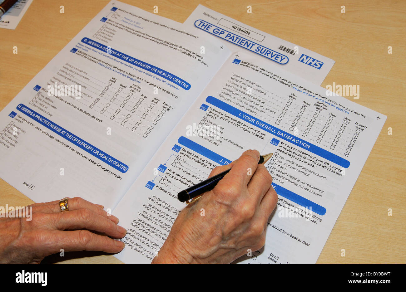 NHS GP patient survey document woman completing the questionnaire Stock ...