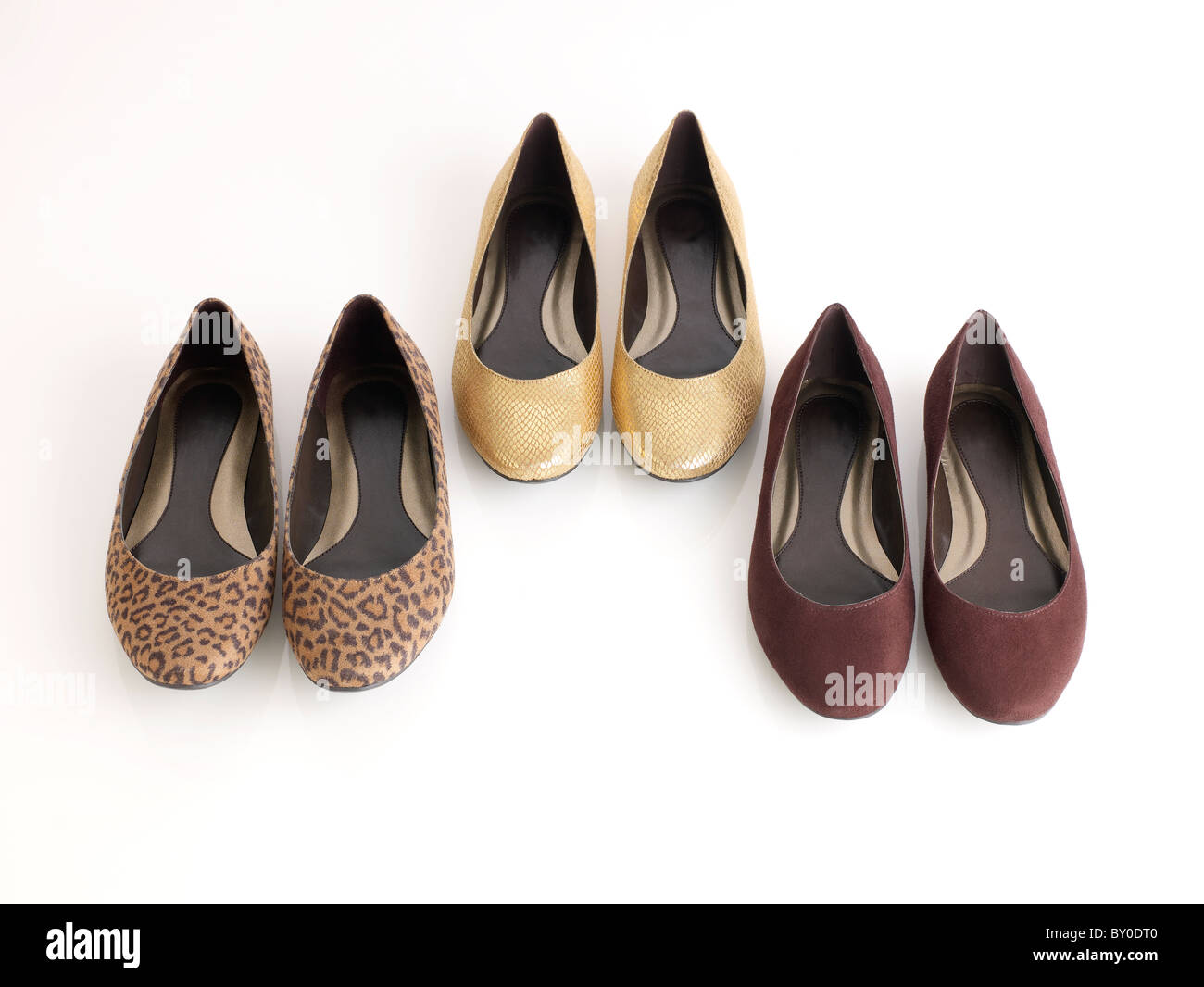 three pairs of womens shoes shot on a white background Stock Photo - Alamy