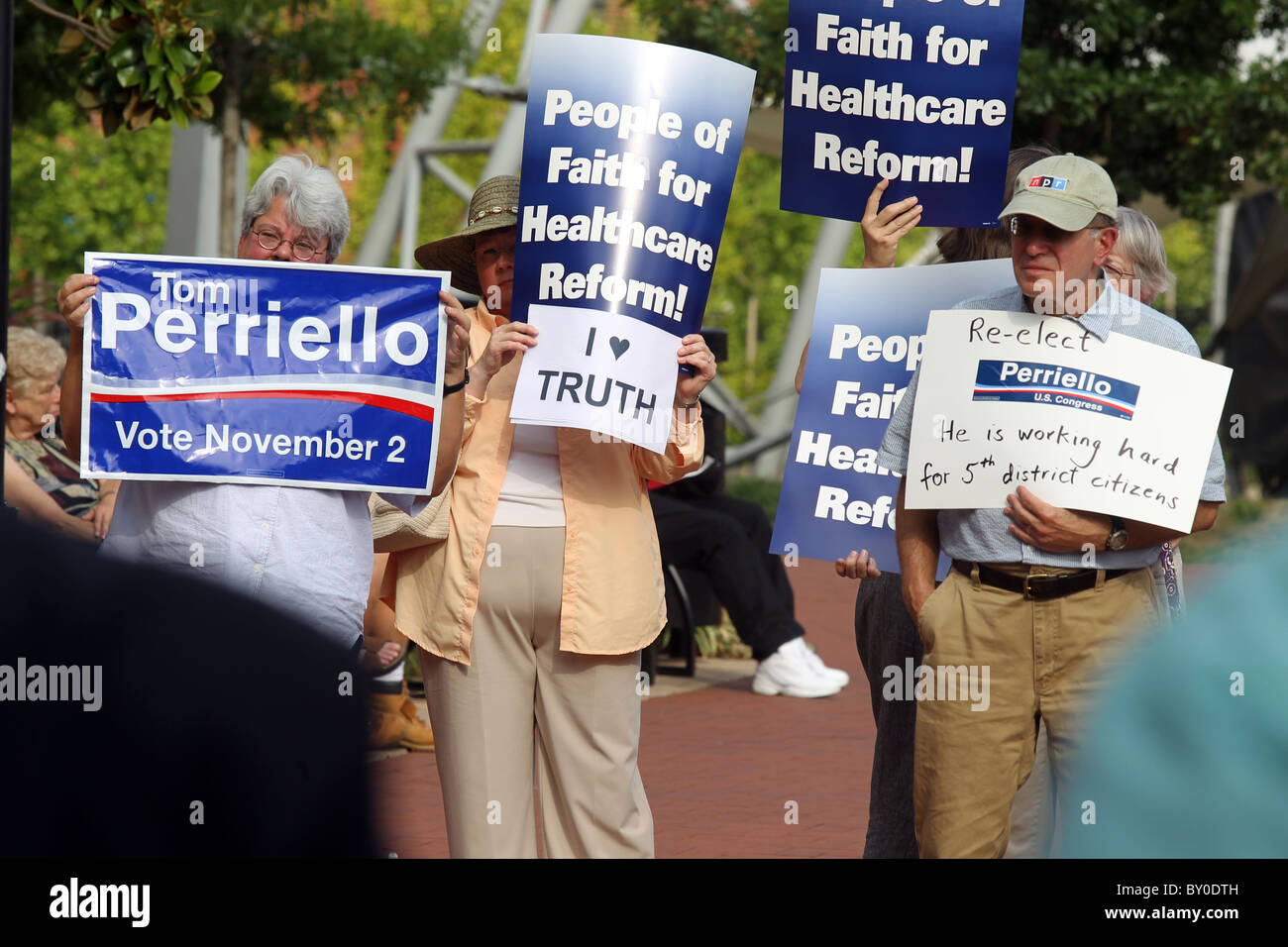 Supporters of Virginia Democrat Tom Perriello hold up signs in support ...