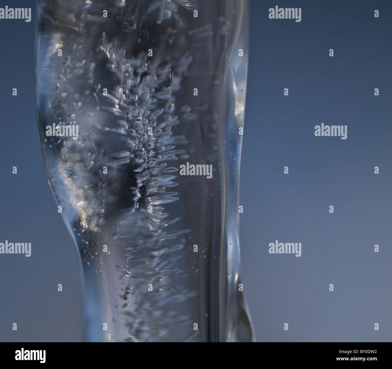 Icicles on branches, with macro view showing the ice formation inside ...