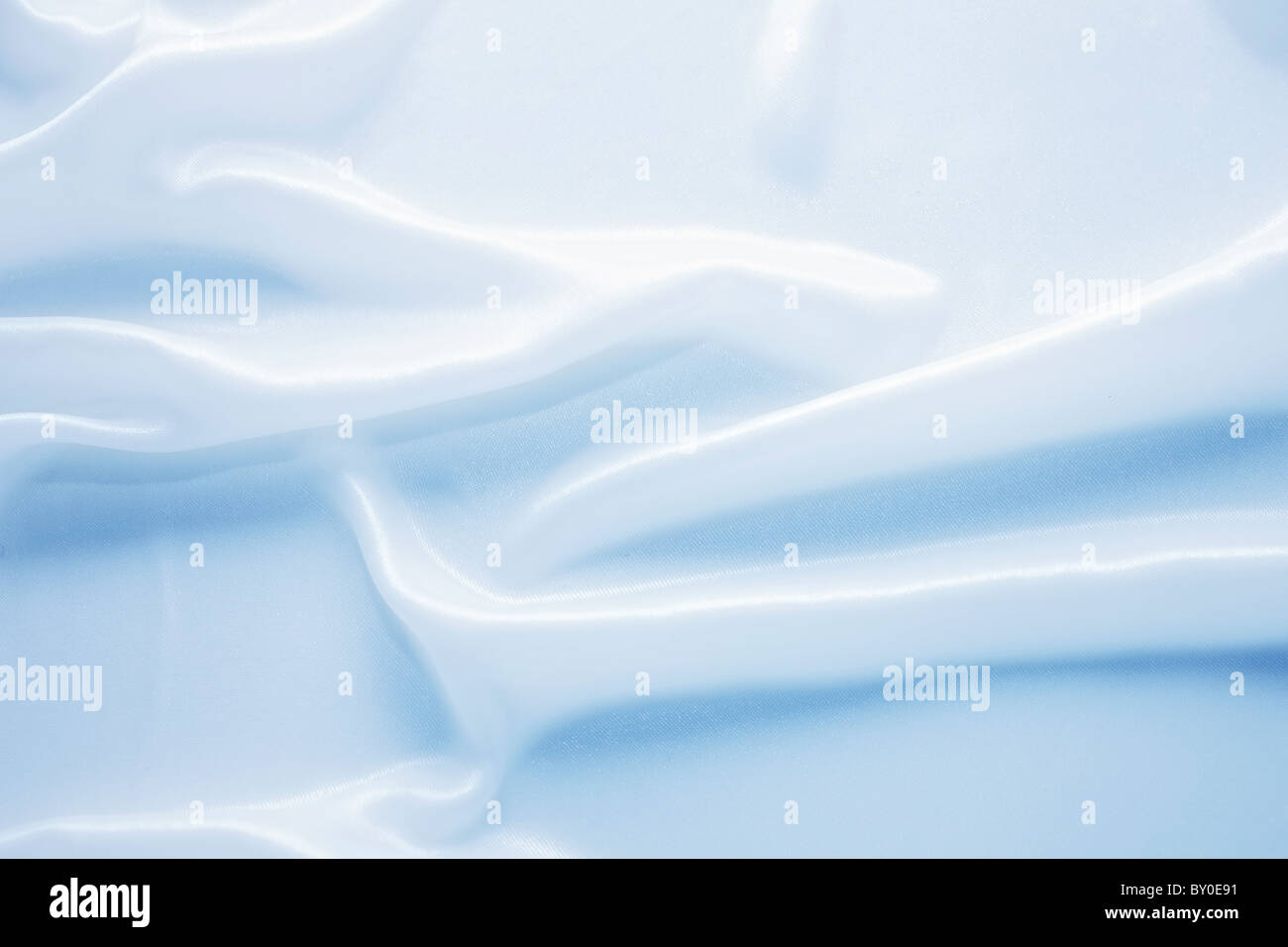 delicate waves of blue satin silk close up Stock Photo - Alamy