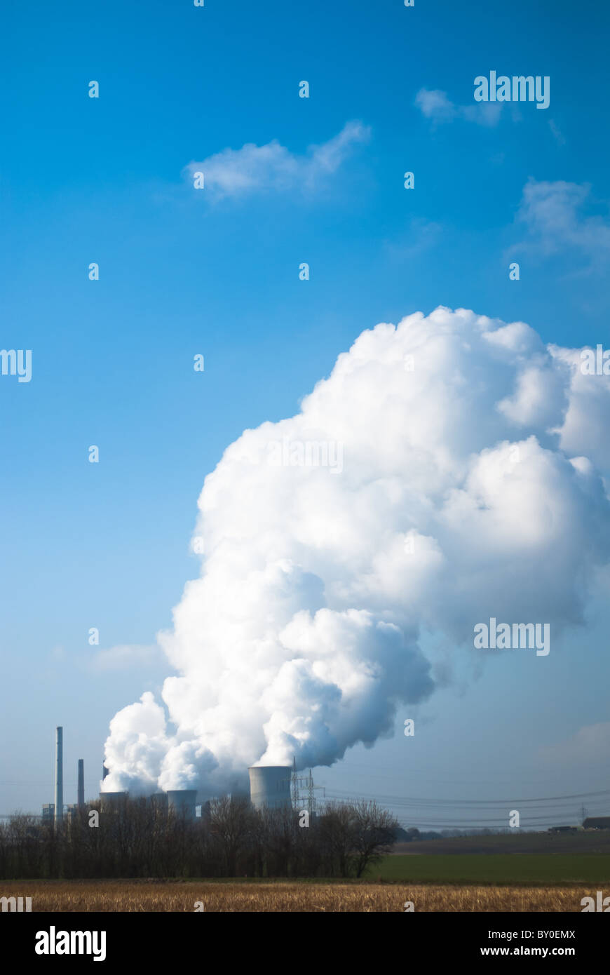 A nuclear power plant blowing huge amounts of smoke in the air Stock ...