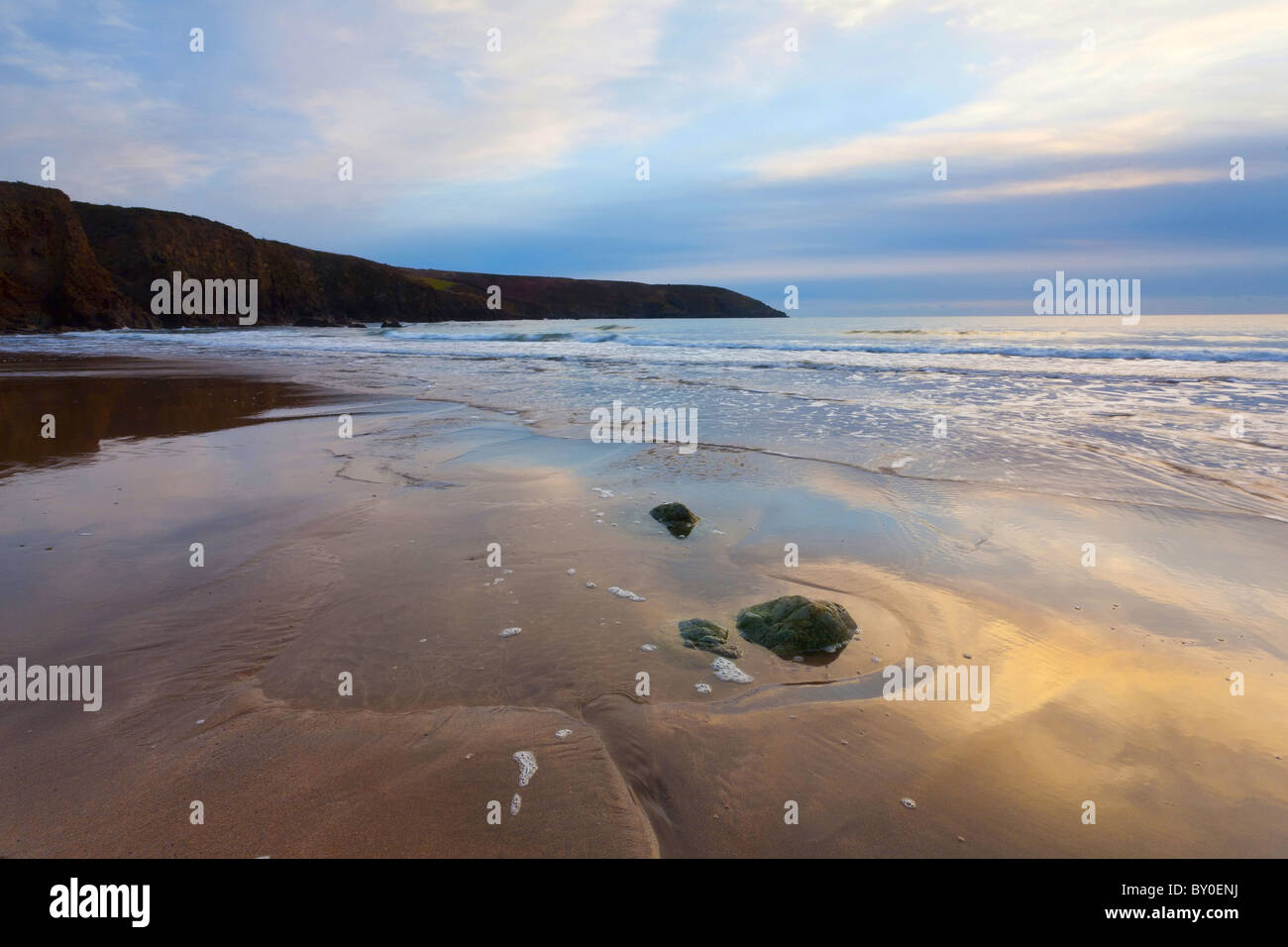 Morning light illuminates beach in County Cork, Republic of Ireland ...