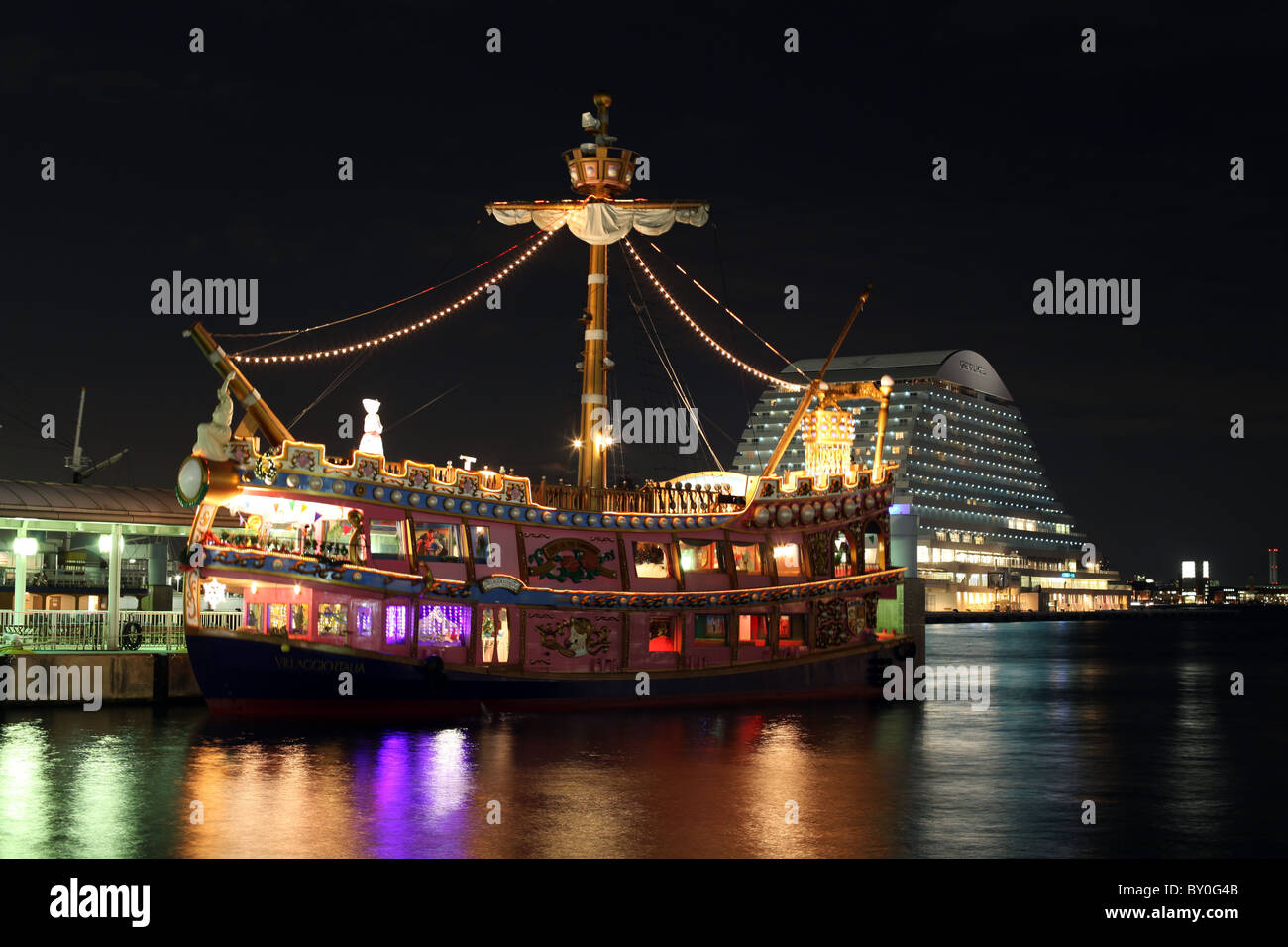 Tourist pirate ship docked in Kobe Harbour at night. Kobe Harbour, Kobe ...