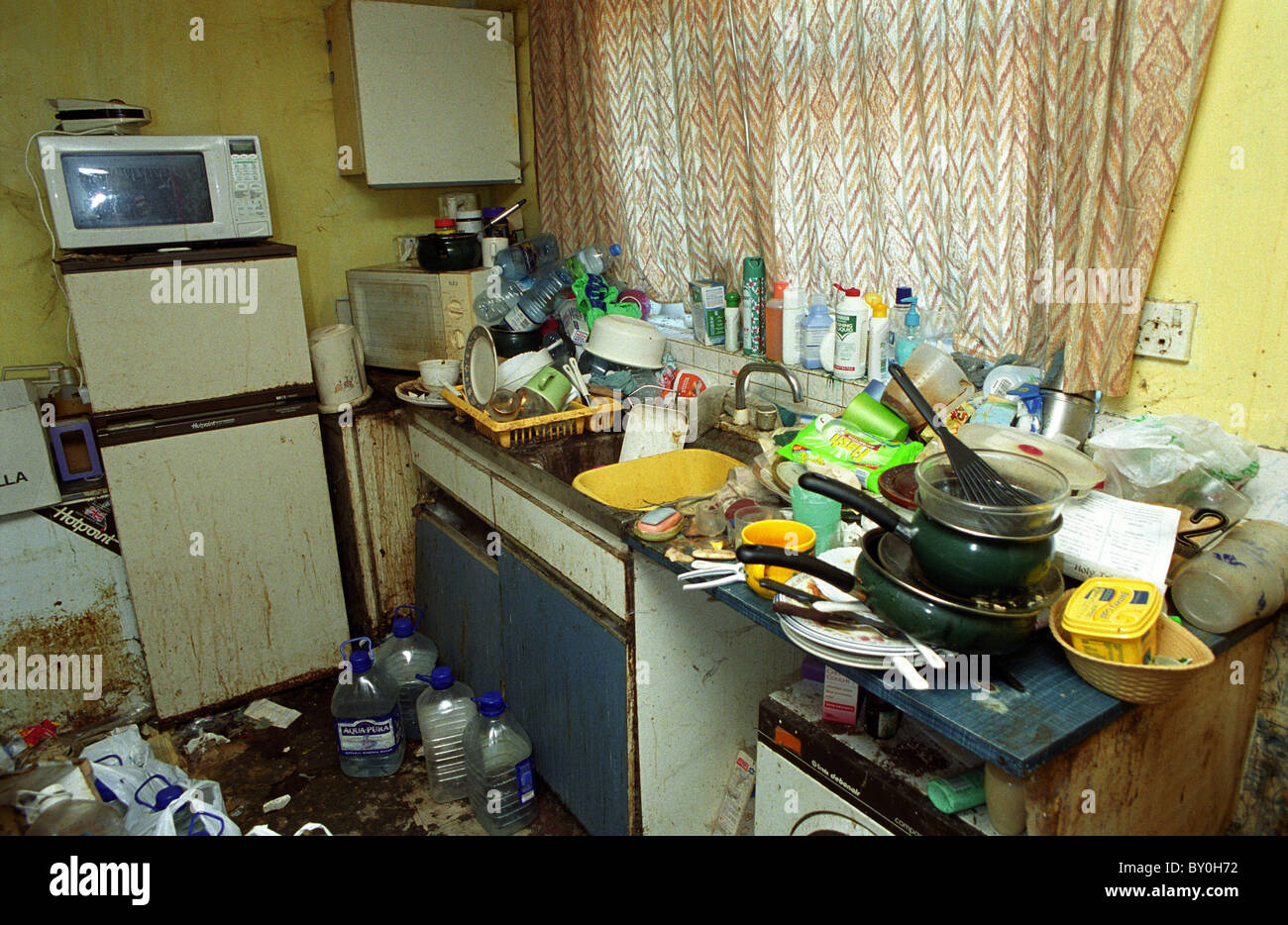 Filthy kitchen in abandoned housing seen after tenant had been evicted ...