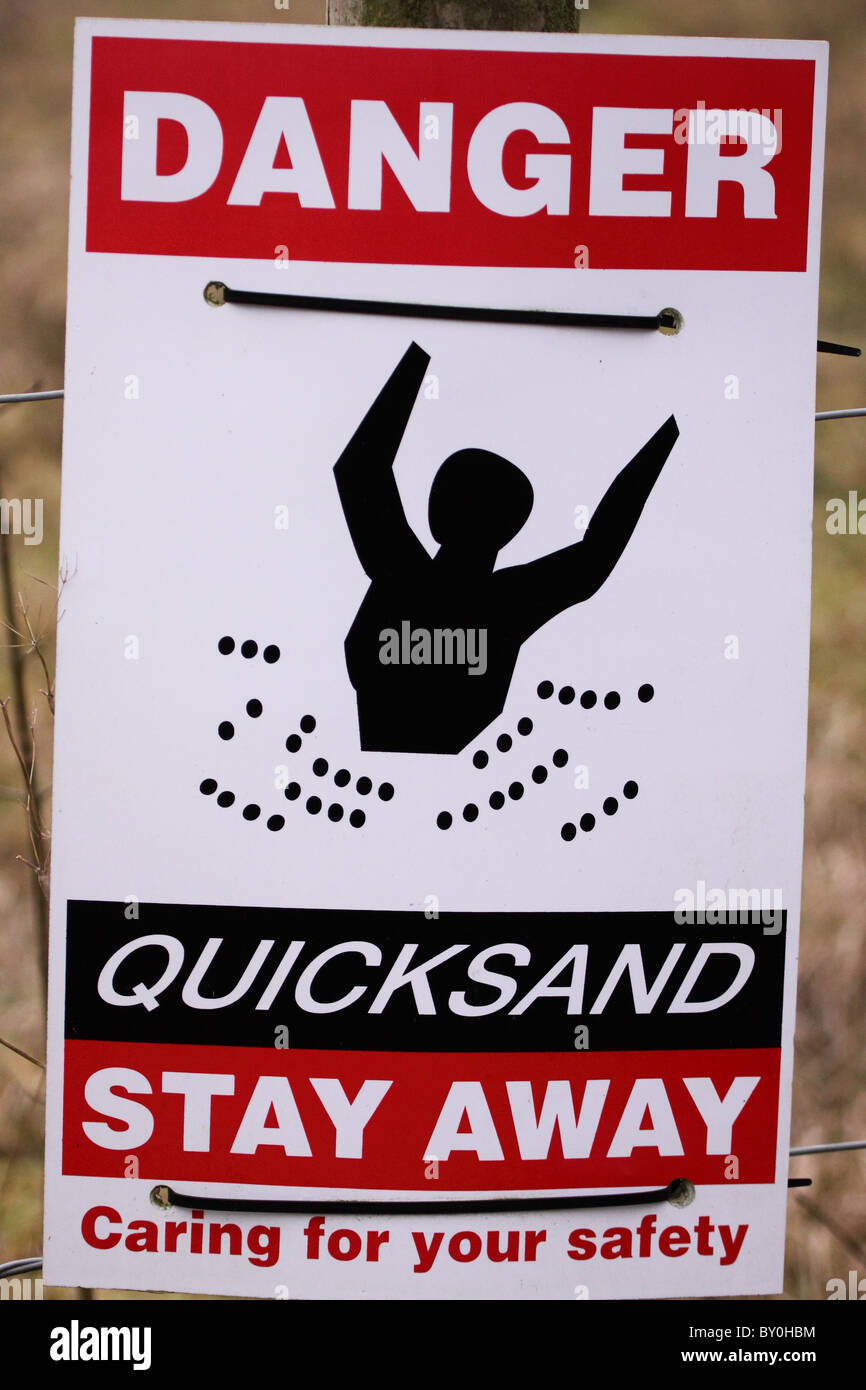 Danger quicksand stay away warning sign Stock Photo - Alamy