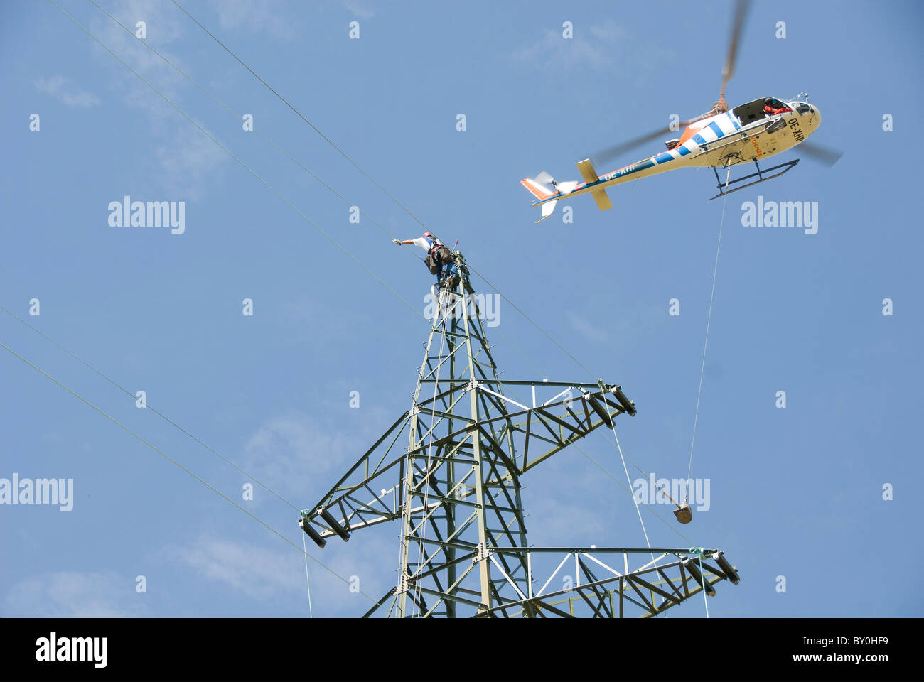 Men working on electricity pylon hi-res stock photography and images ...