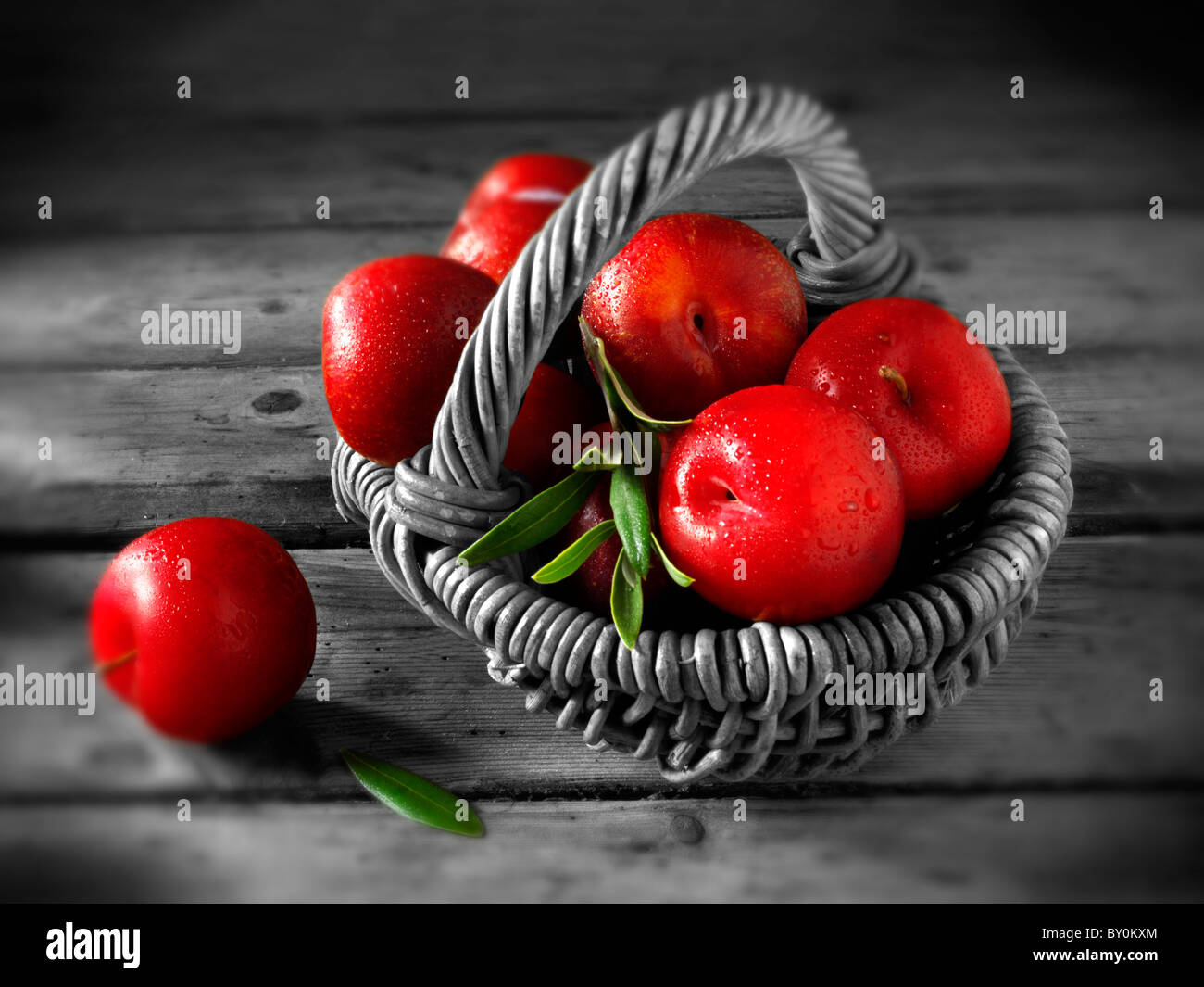 Fresh whole red plums Stock Photo - Alamy