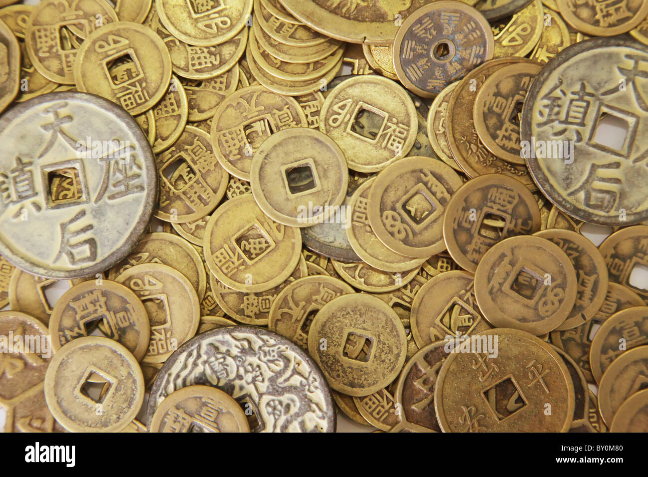Chinese Coins in a Pile as Background Stock Photo - Alamy