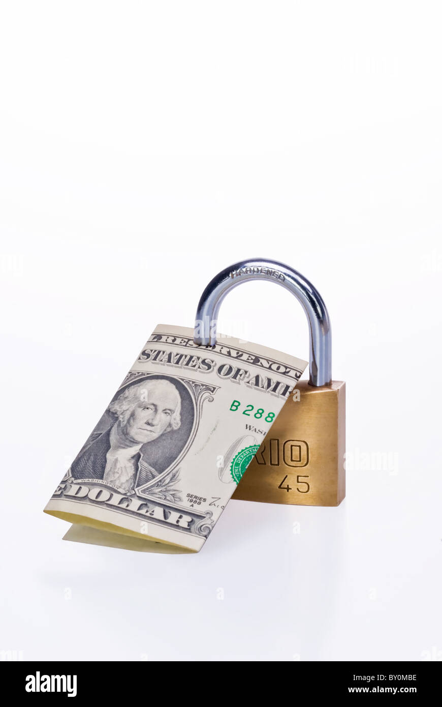a dollar bill stuck in a padlock, to convey a concept of security for ...