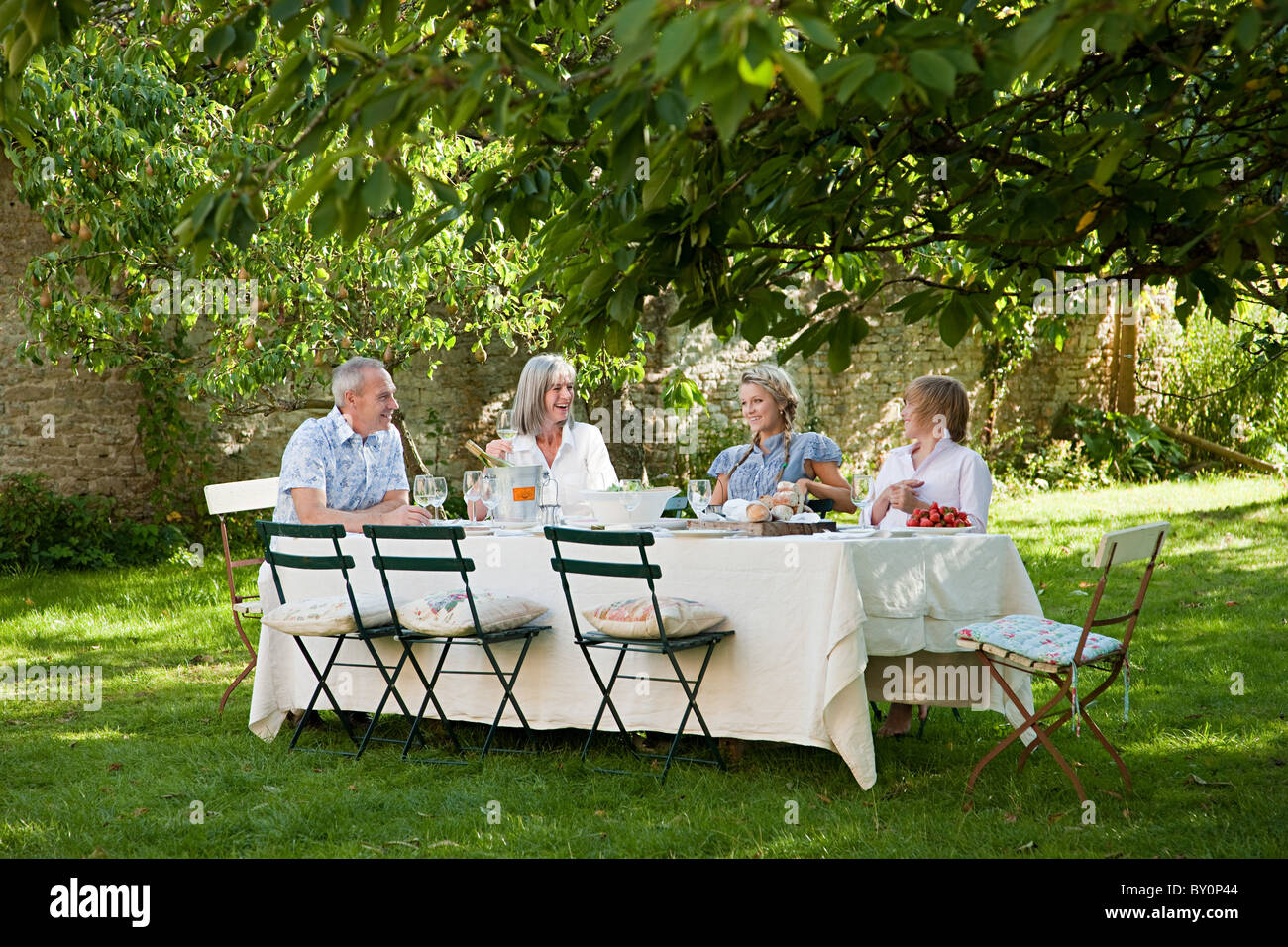 Family having lunch outdoors Stock Photo - Alamy